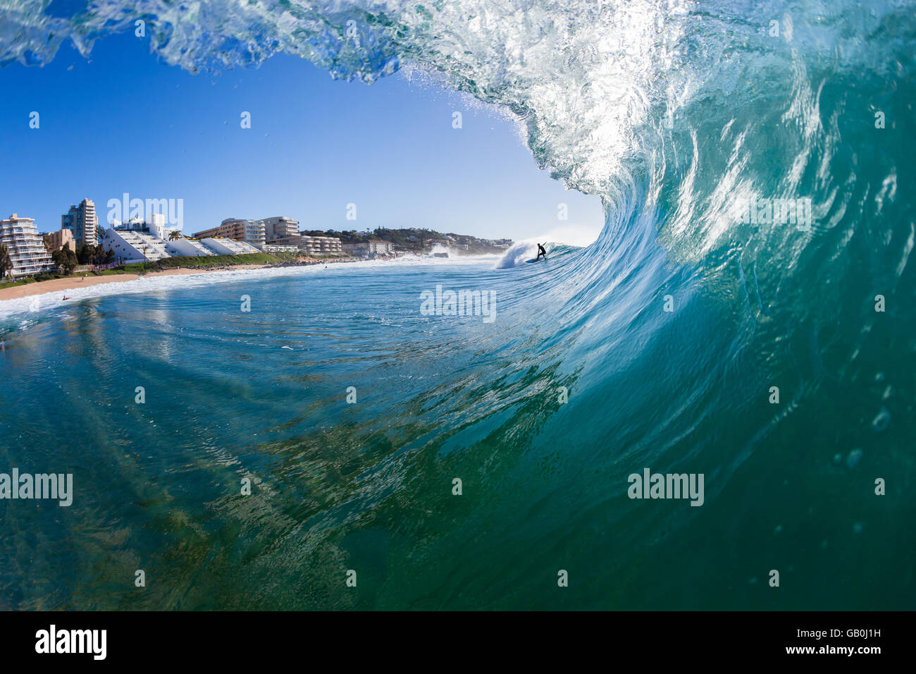 Ocean wave surfer perspective inside hollow tube closeup swimming water ...