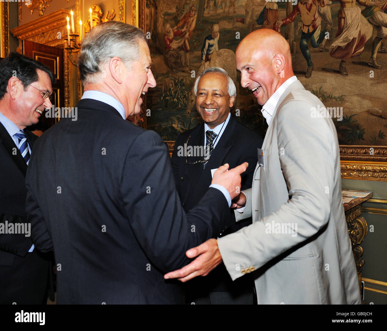 The Prince of Wales speaks to architect, Jerry Harrall (r) who is the ...