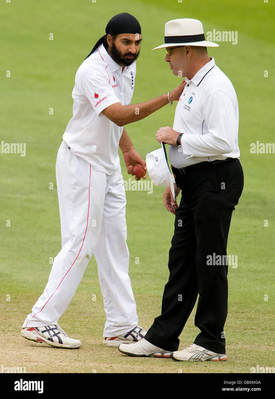 England's Monty Panesar talks to umpire Daryl Harper during The First ...