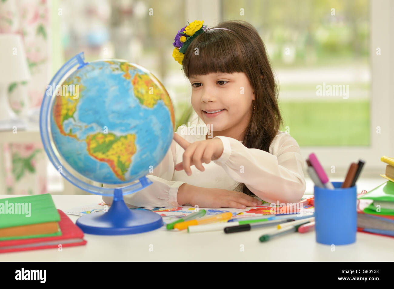 Little girl drawing at class Stock Photo - Alamy