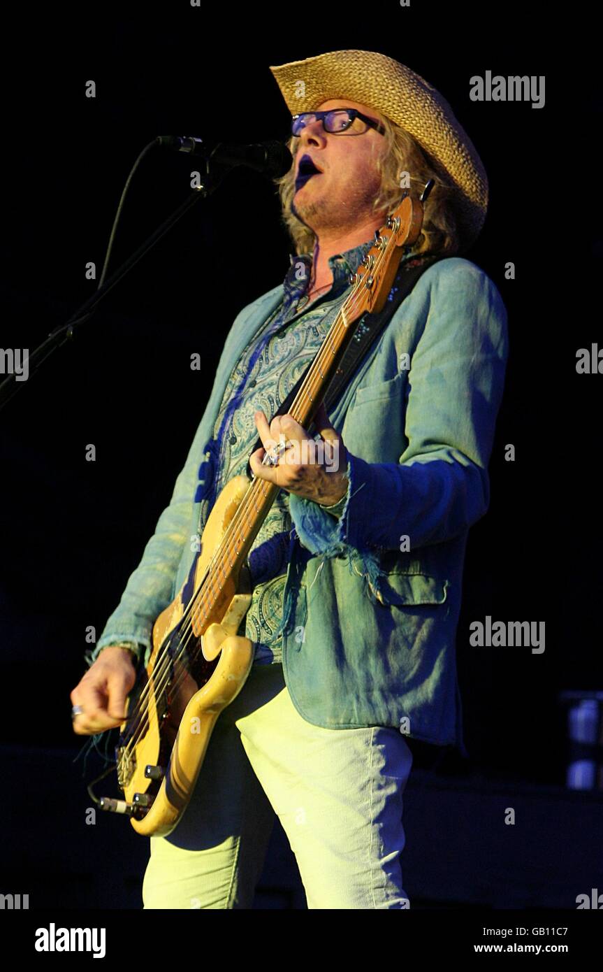 Mike Mills on stage during REM's performance during the Oxegen Festival ...