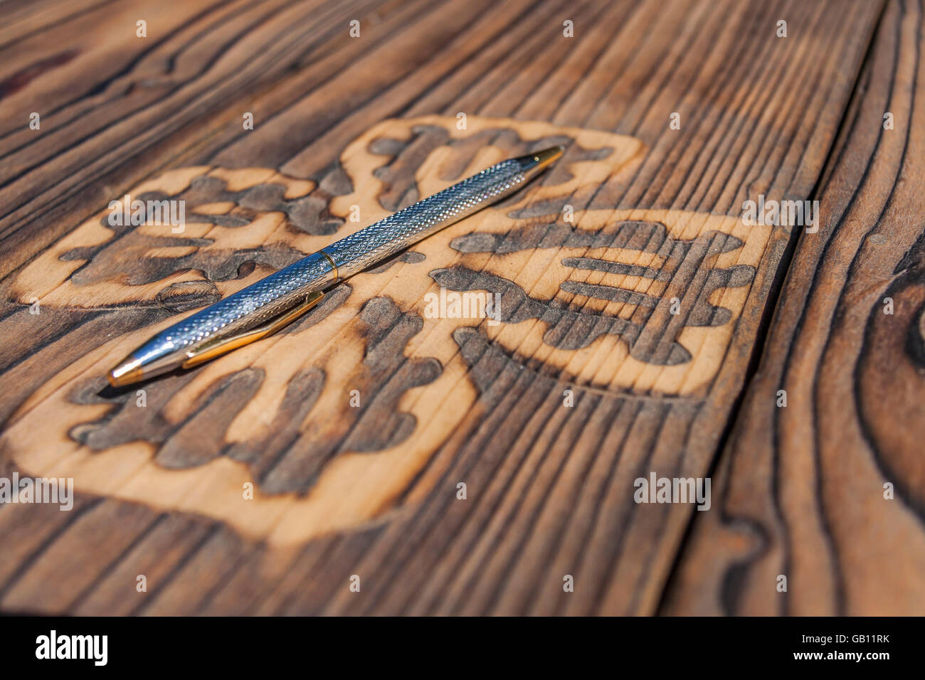 One Pen On Wooden Desk Stock Photo - Alamy