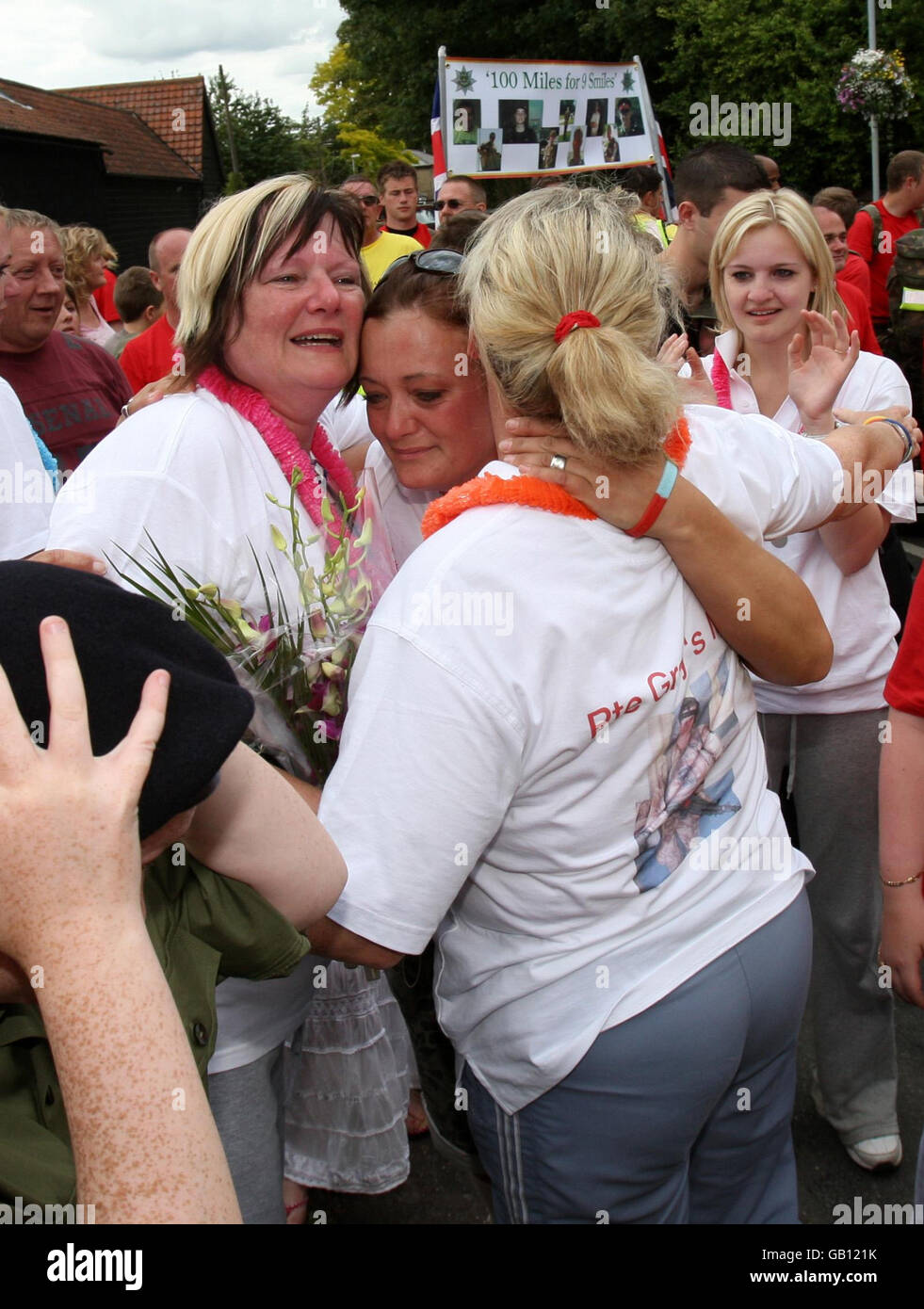 Christine Bonner and fellow walkers embrace after leading the 100-mile ...