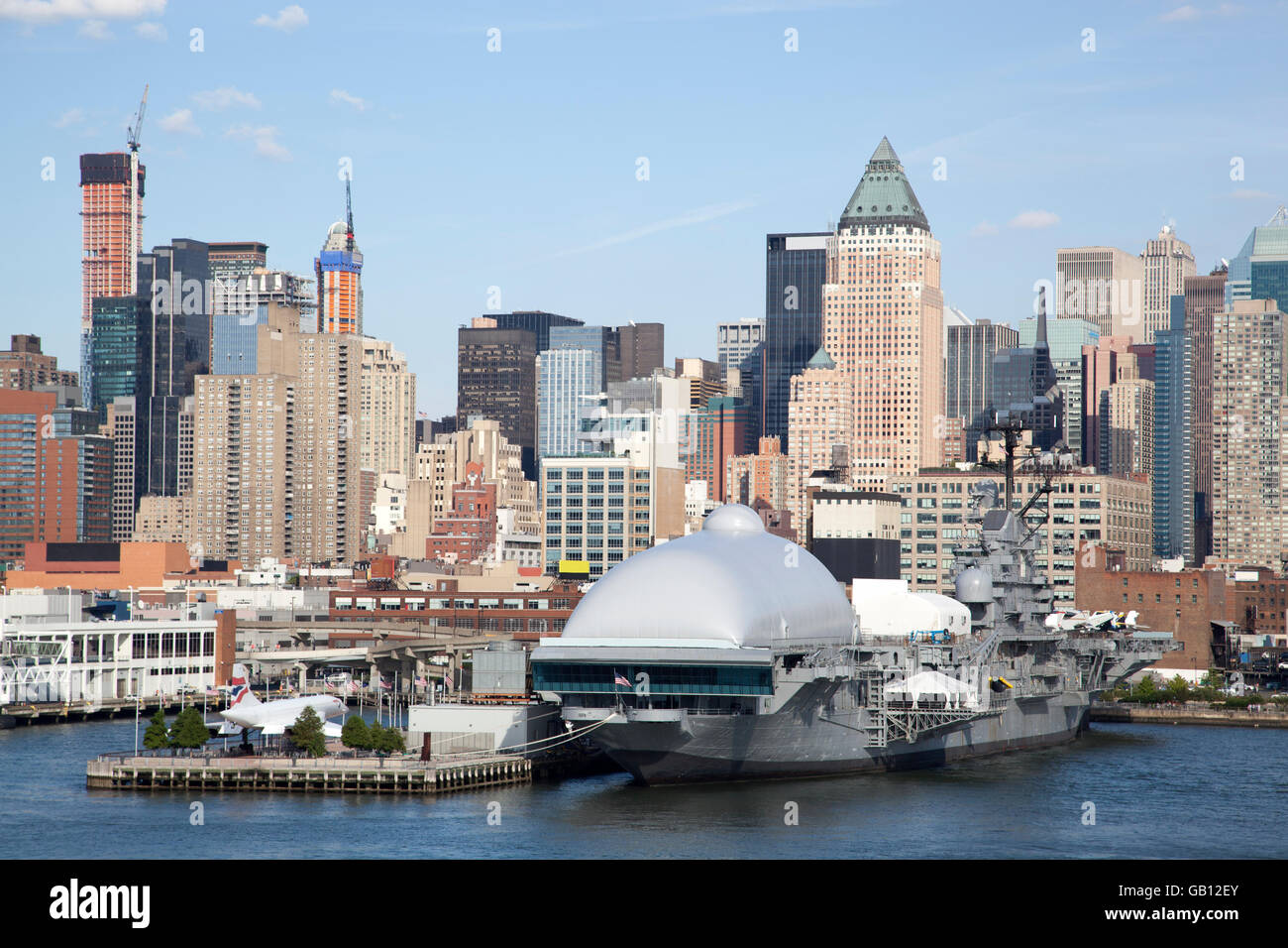 The view of historic military ship with Manhattan skyline in a ...