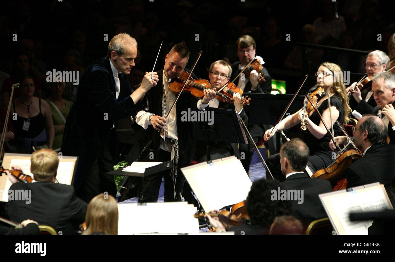 Nigel Kennedy (centre, standing) performs with the BBC Concert ...