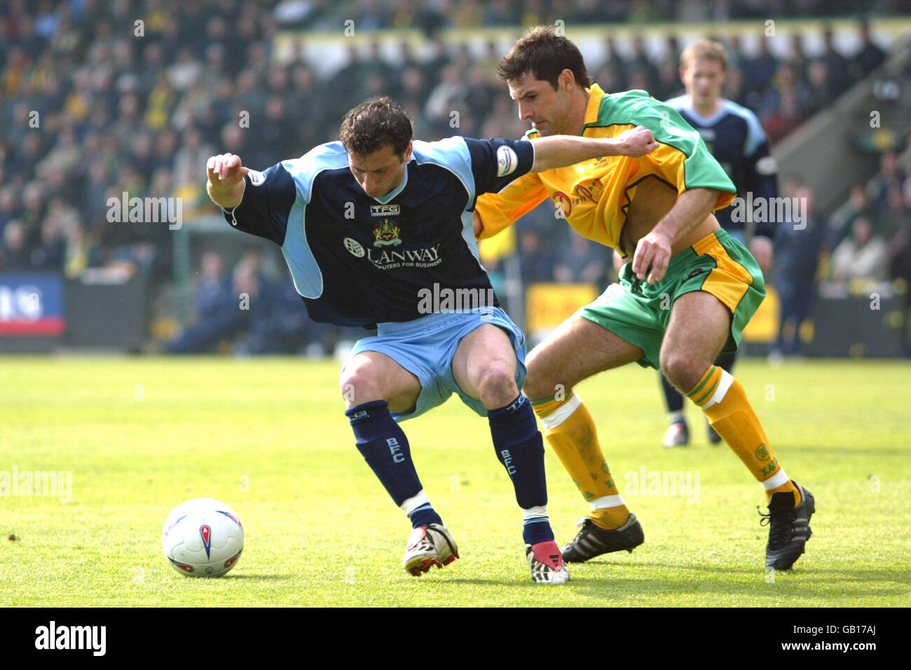 (L-R) Burnley's Dimitrios Papadopoulos shields the ball from Steen ...