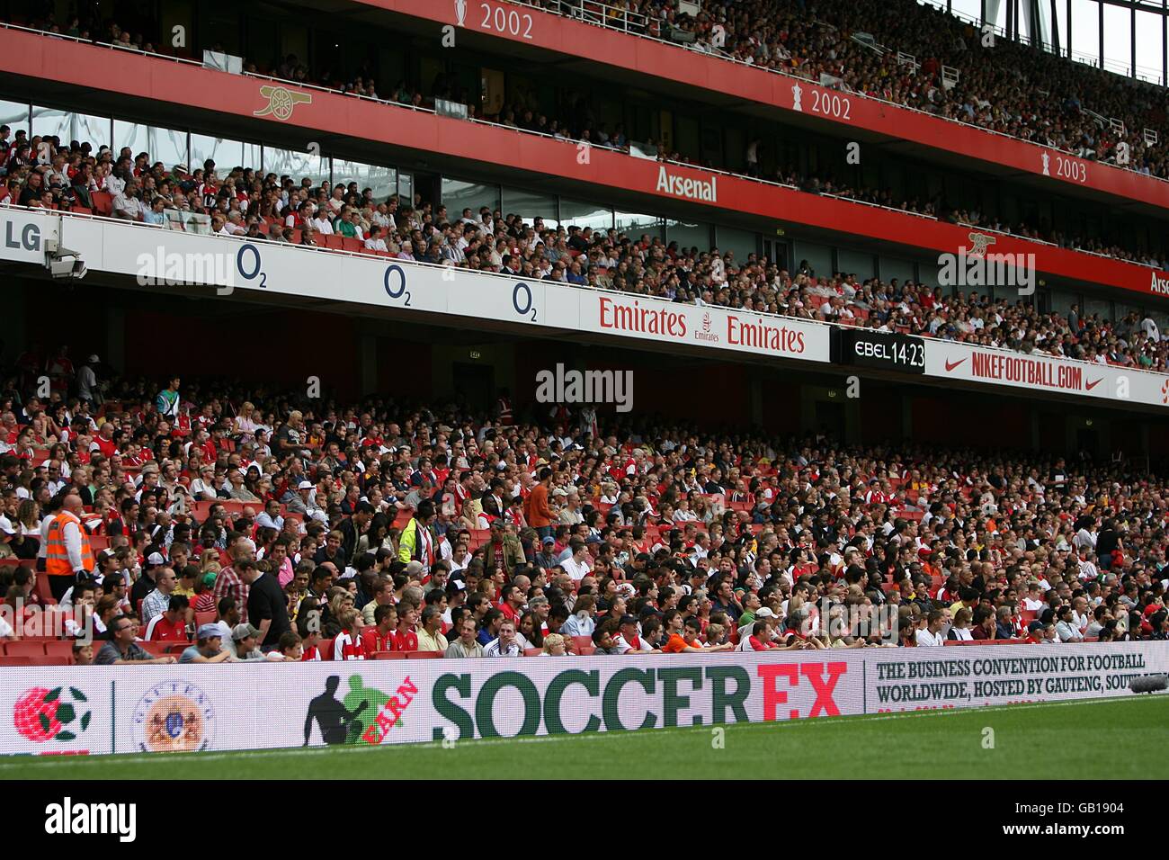 Football fans watch the action from the stands hi-res stock photography ...
