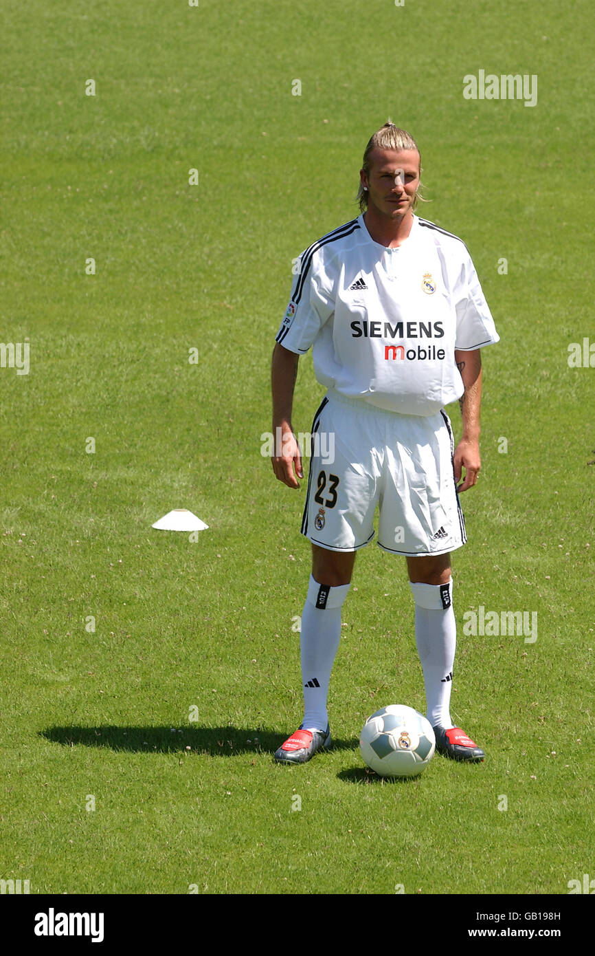 David beckham poses for photographs after signing for real madrid hi ...