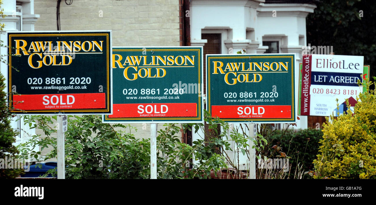 House market. General view of estate agents boards advertising sold ...