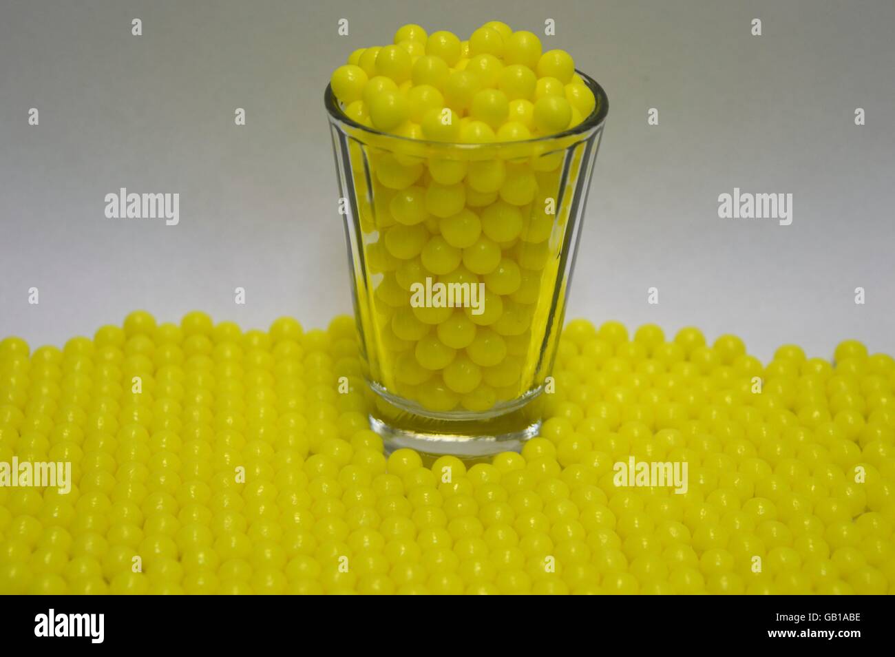 Yellow balls in glass Stock Photo - Alamy