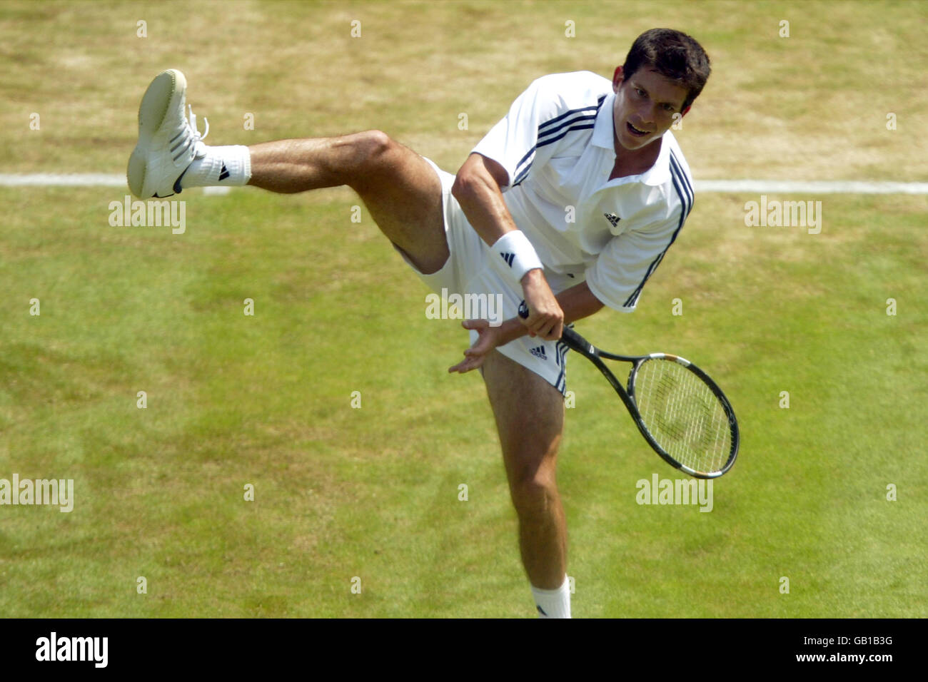 Tim henman smashes the ball back to michael llodra hi-res stock ...