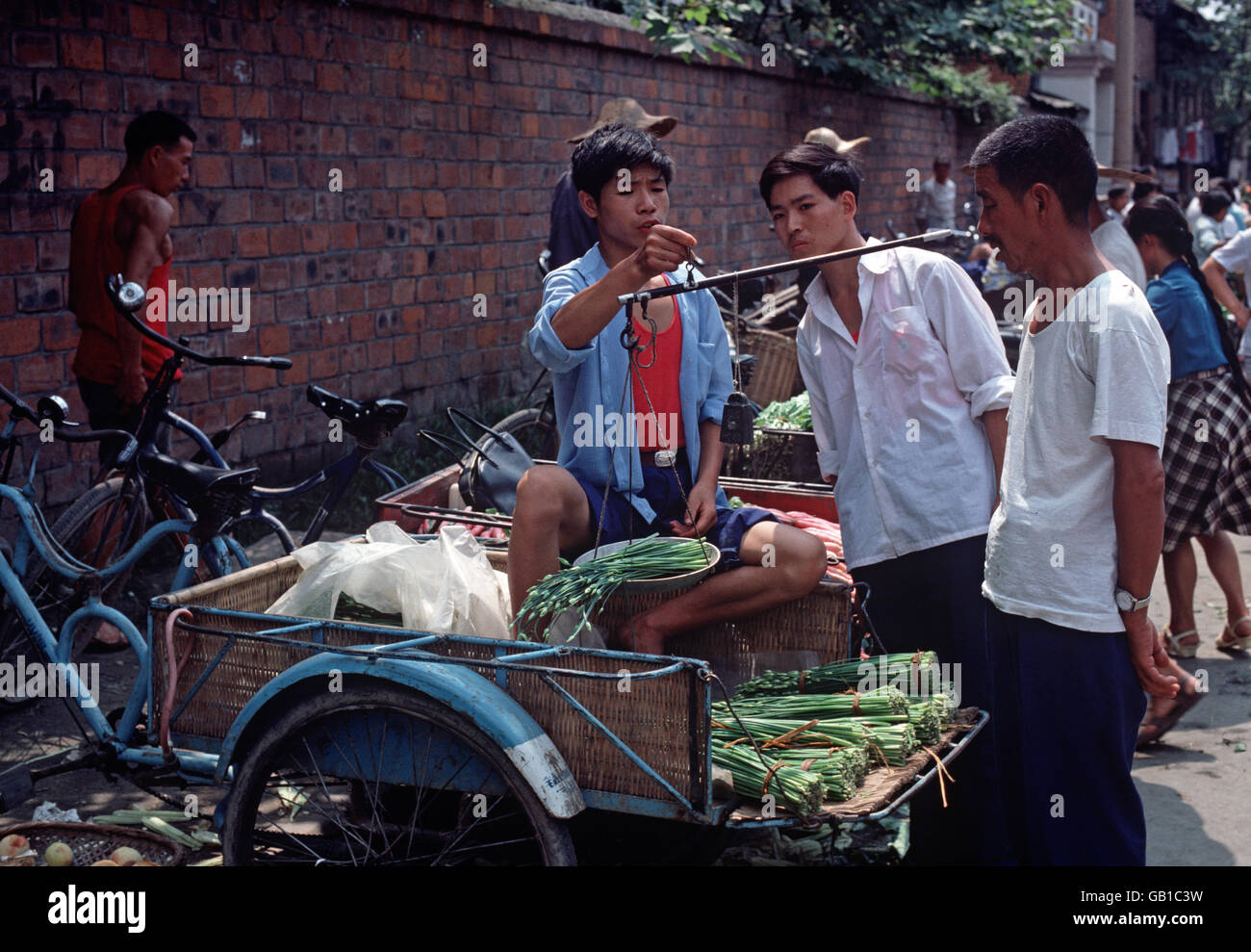 weighing vegetables in Chengdu market, Chengdu, Sichuan Province, China ...