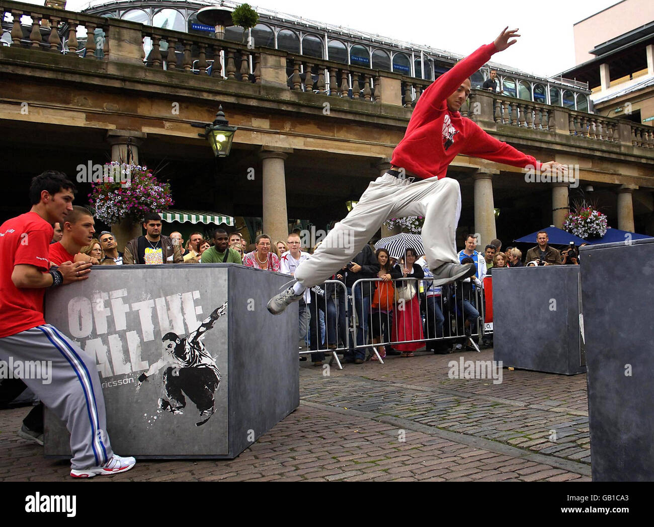 A free runner performs a jump in Covent Garden, London, as part of the ...