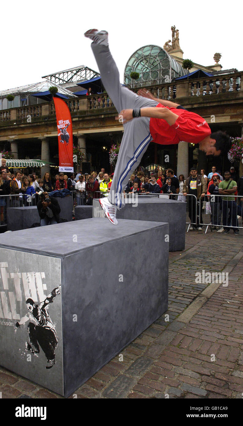A free runner performs a stunt in Covent Garden, London, as part of the ...