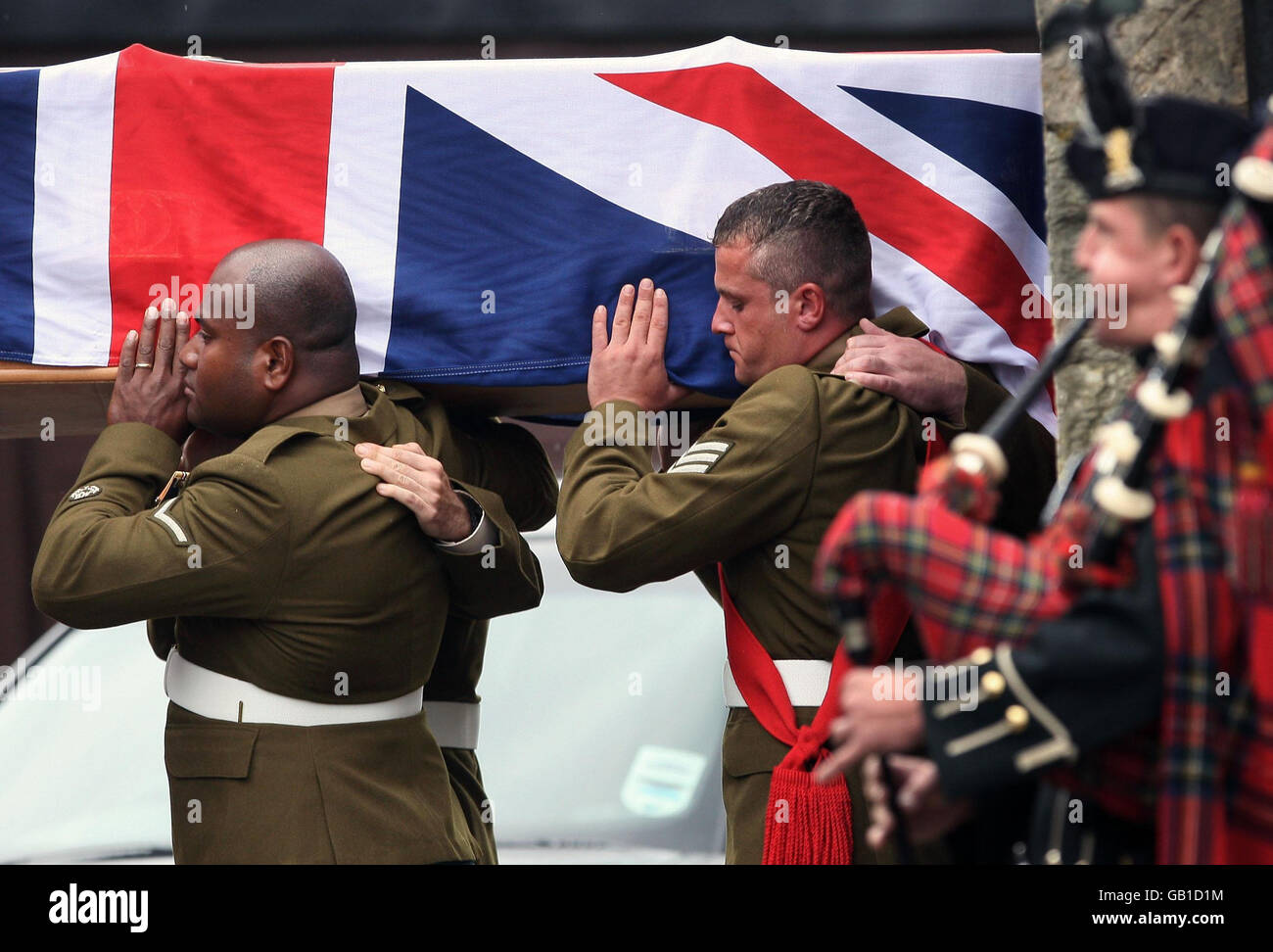 The coffin of Sergeant Jonathan William Mathews, 35, is carried out of ...