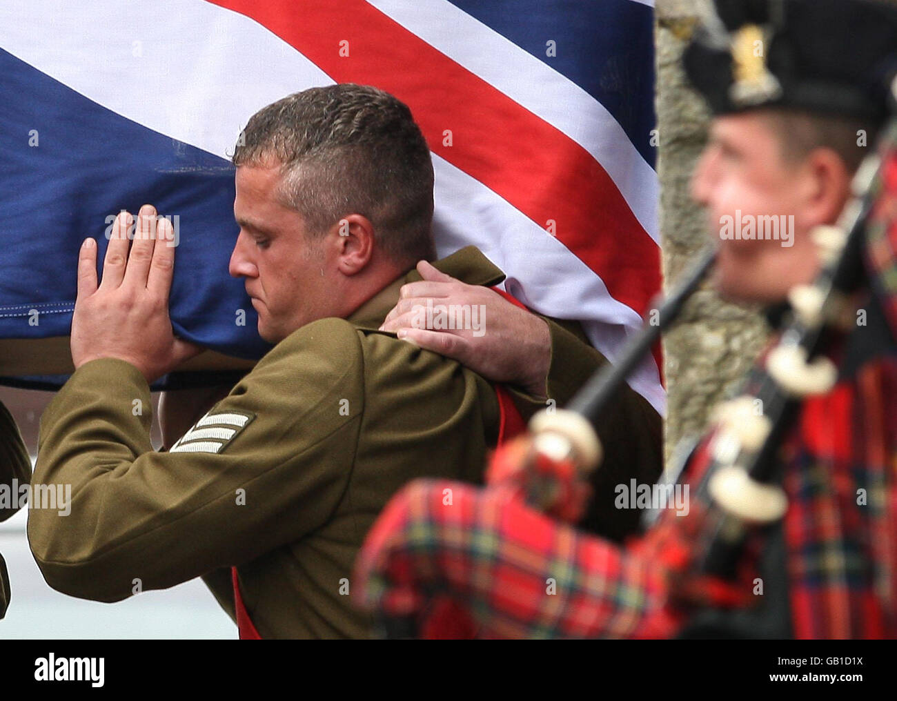 The coffin of Sergeant Jonathan William Mathews, 35, is carried out of ...