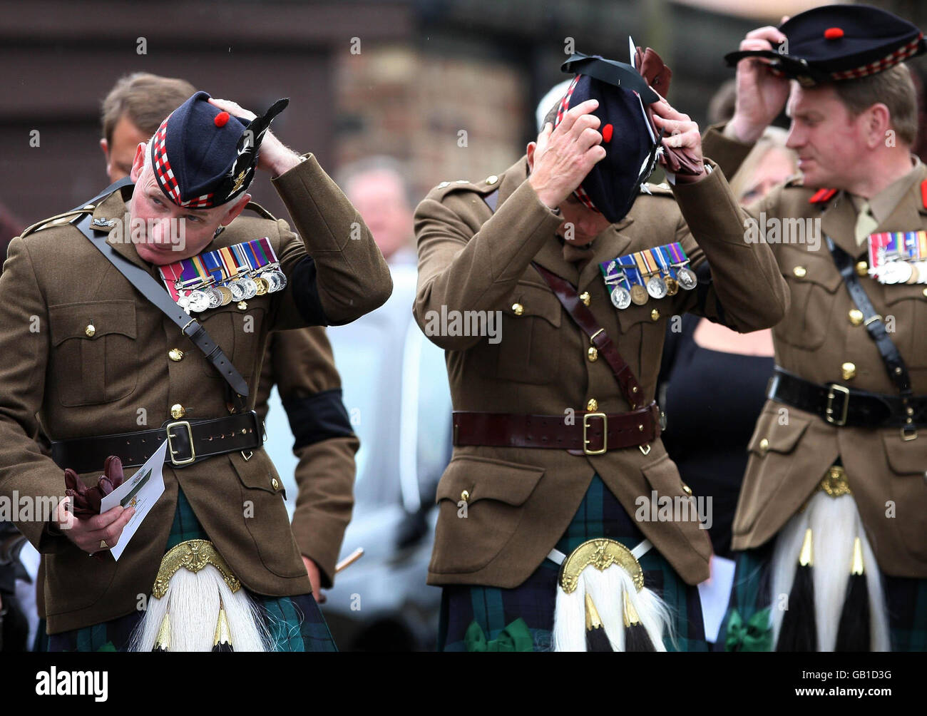 Mourners leave the funeral of Sergeant Jonathan William Mathews, 35, at ...