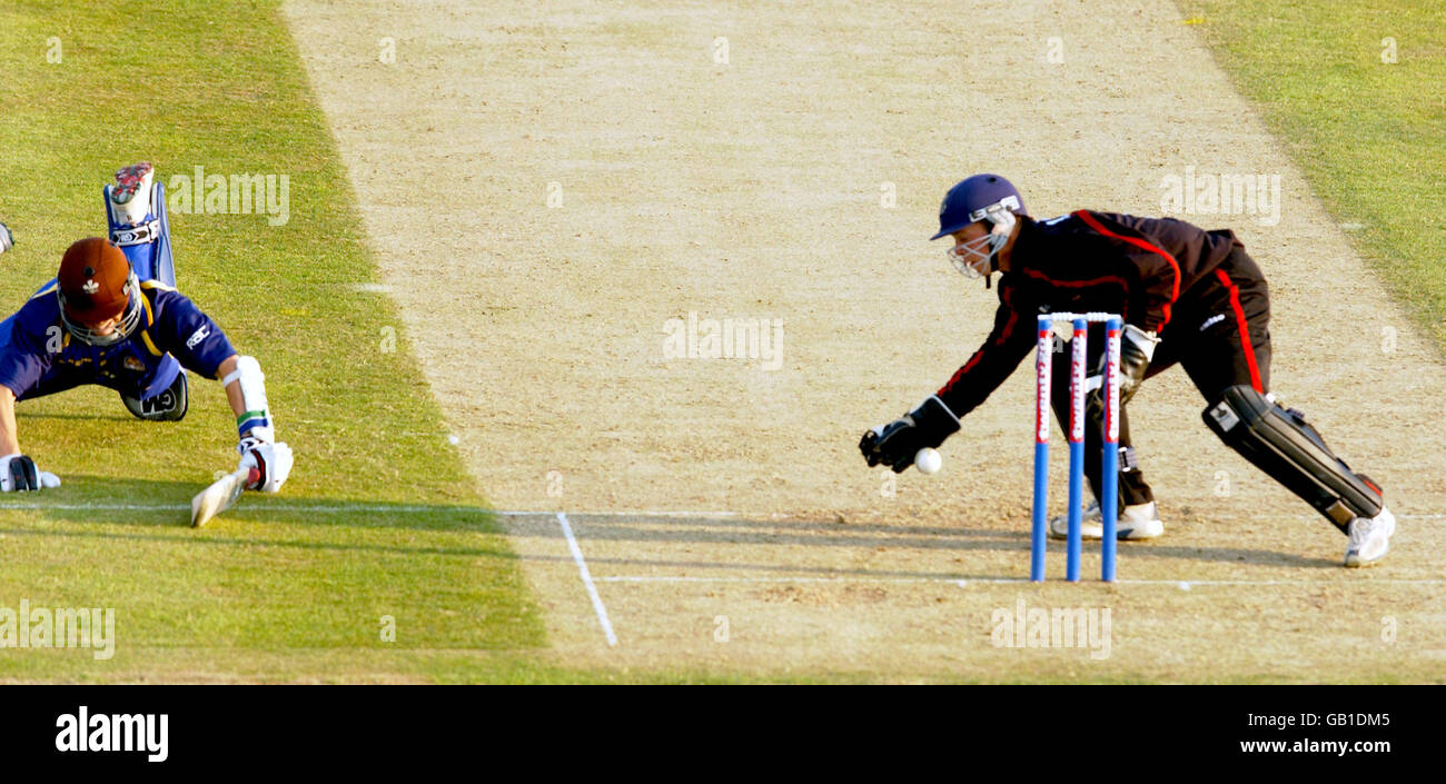 Surrey batsman Jonathan Batty dives into the crease to prevent Sussex ...