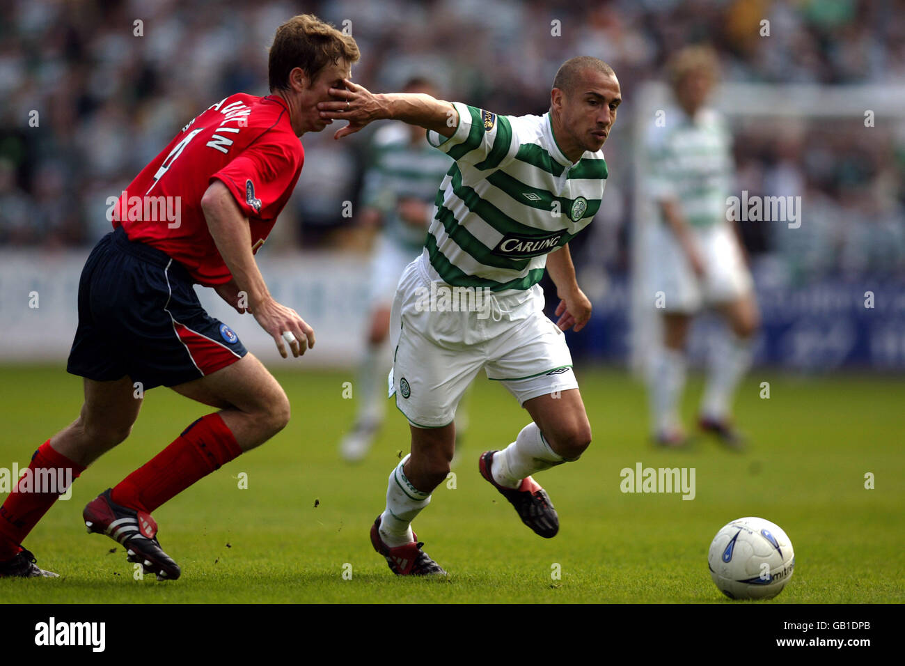 Celtic's Henrik Larsson (r) shields the ball from Kilmarnock's Barry ...