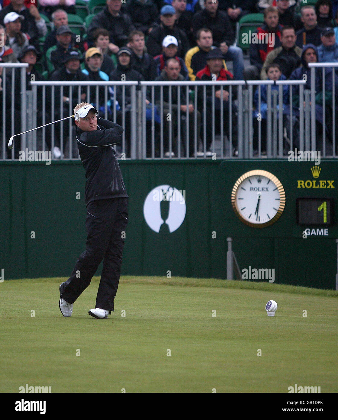 England's Simon Dyson in the first group to tee off on the 1st hole ...