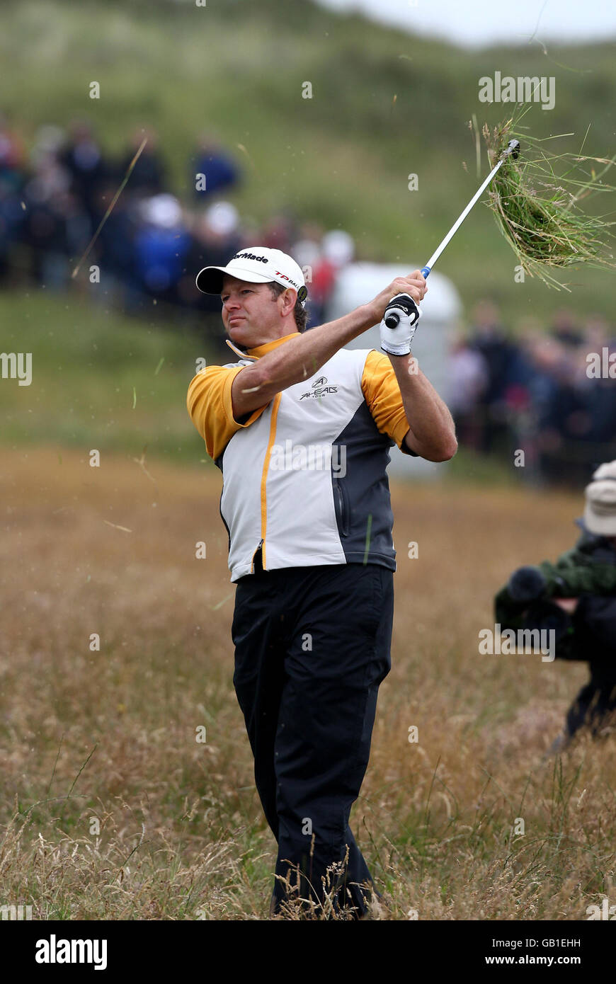 South Africa's Retief Goosen plays from rough on the 11th during Round ...