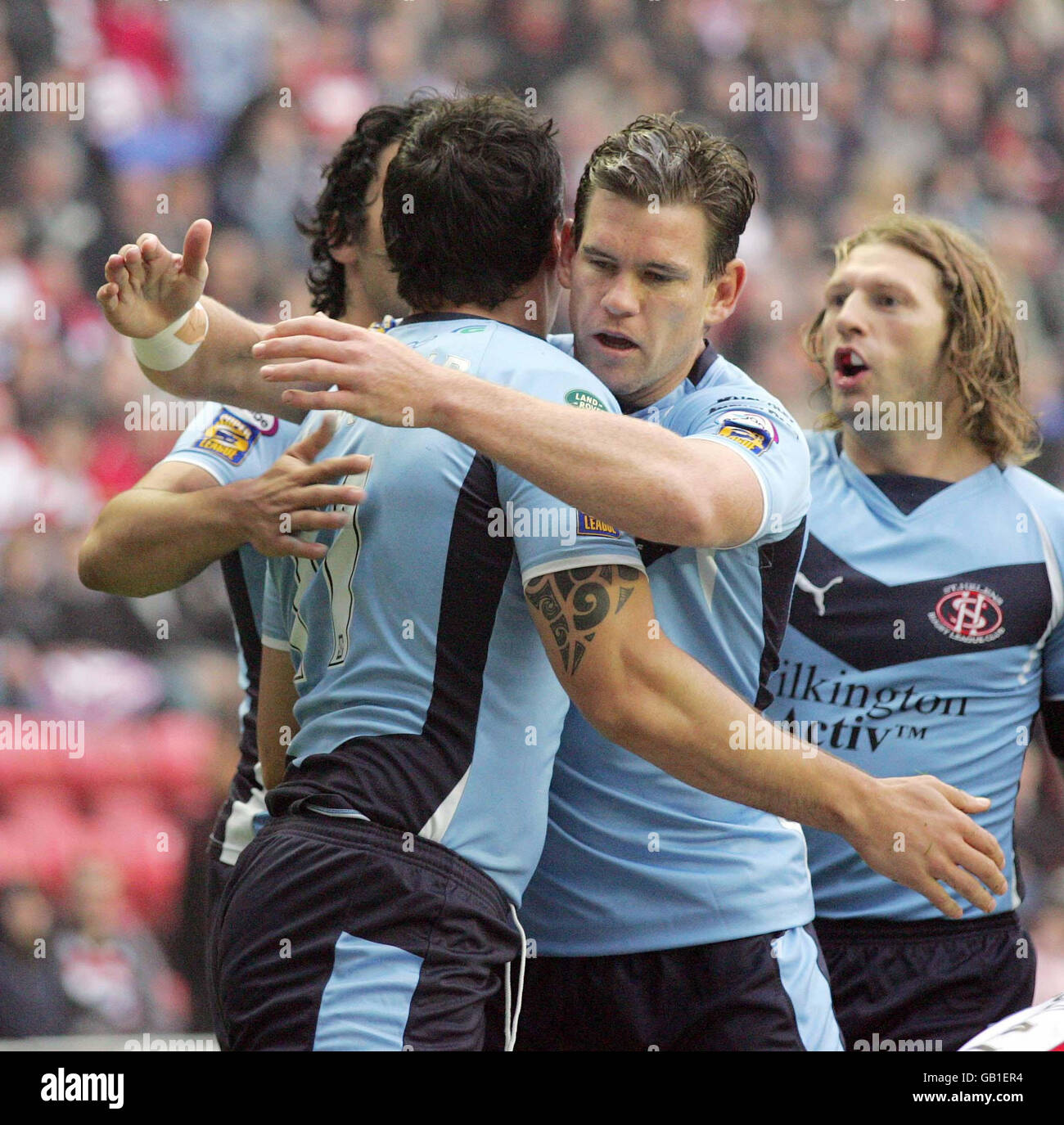 St Helens's Lee Gilmour celebrates with team-mate Matt Gidley (R) after ...