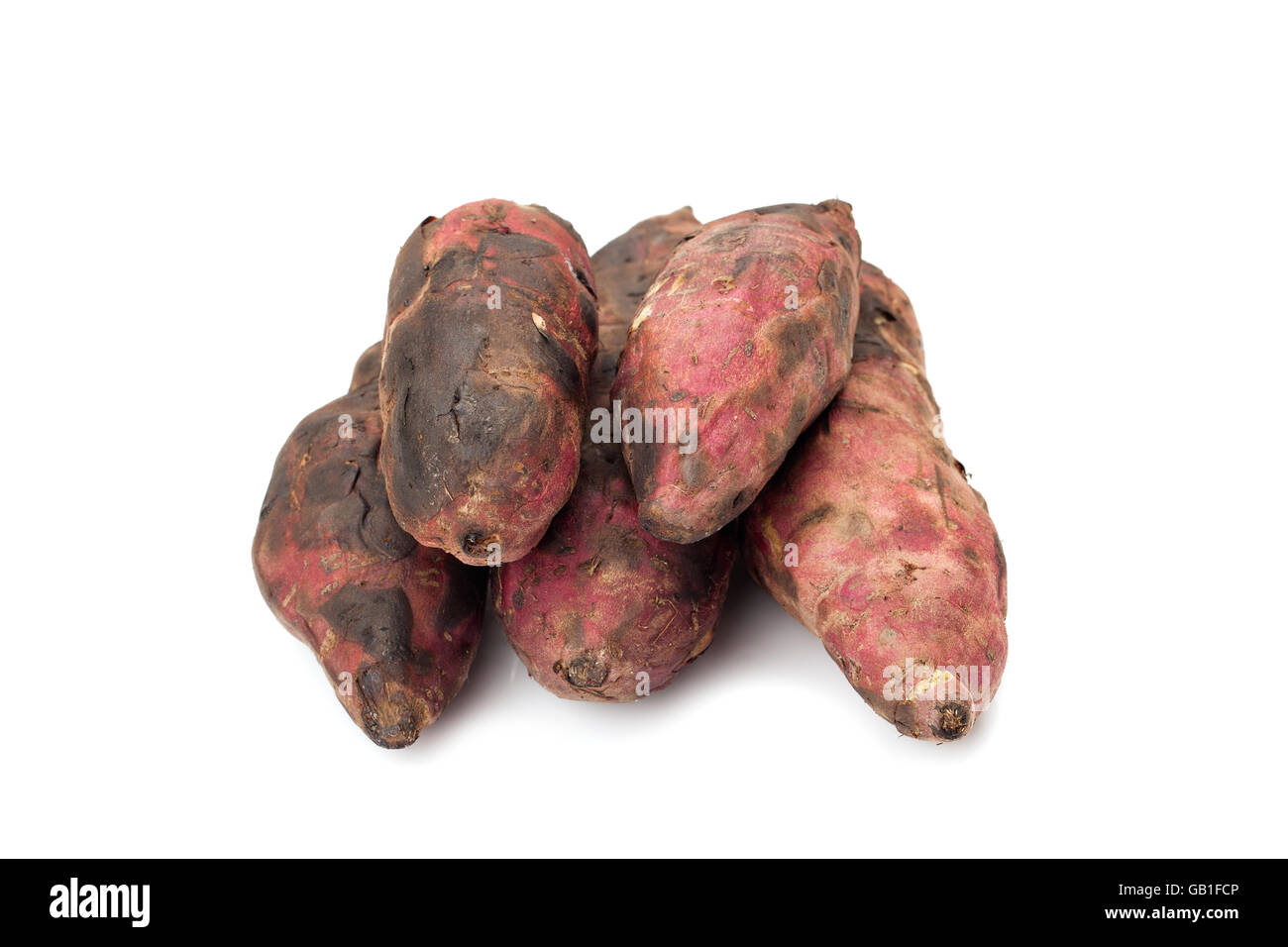Roasted Sweet Potatoes on white background with shadow Stock Photo - Alamy