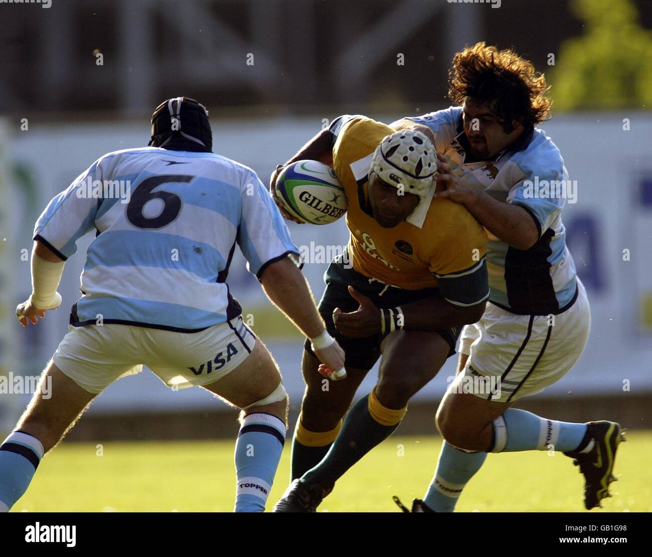 Australias jone tawake is stopped by the argentinians hi-res stock ...