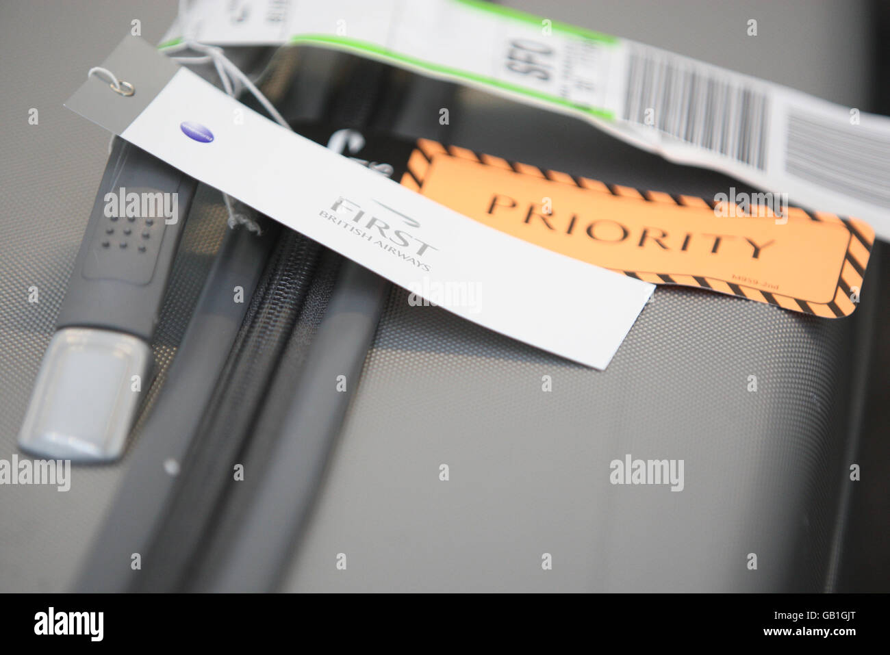 A British Airways priority baggage label and First Class label on a ...