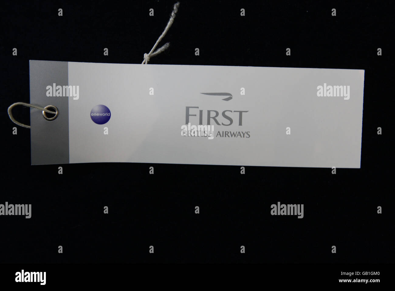 A british airways first class luggage label at heathrow airport hi-res ...