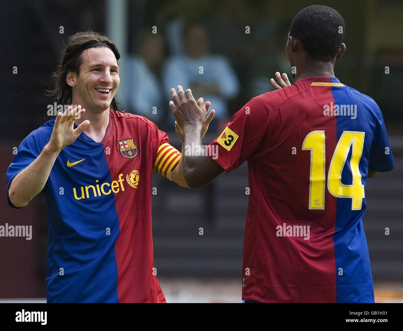 Lionel Messi of FC Barcelona celebrates his hat-trick with teammate ...
