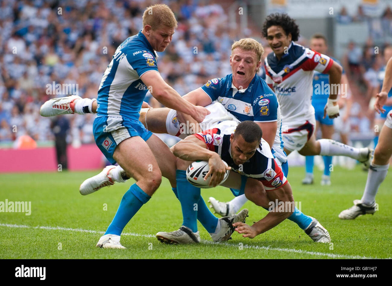 Wakefield's Ryan Atkins scores a try past Hull FC's Danny Washbrook ...