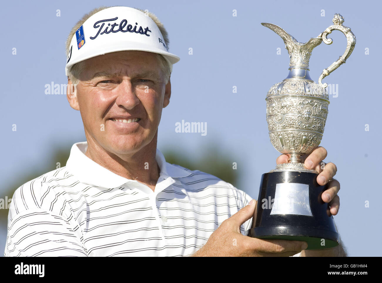 Bruce Vaughan lifts the claret jug after winning a play off to decide ...