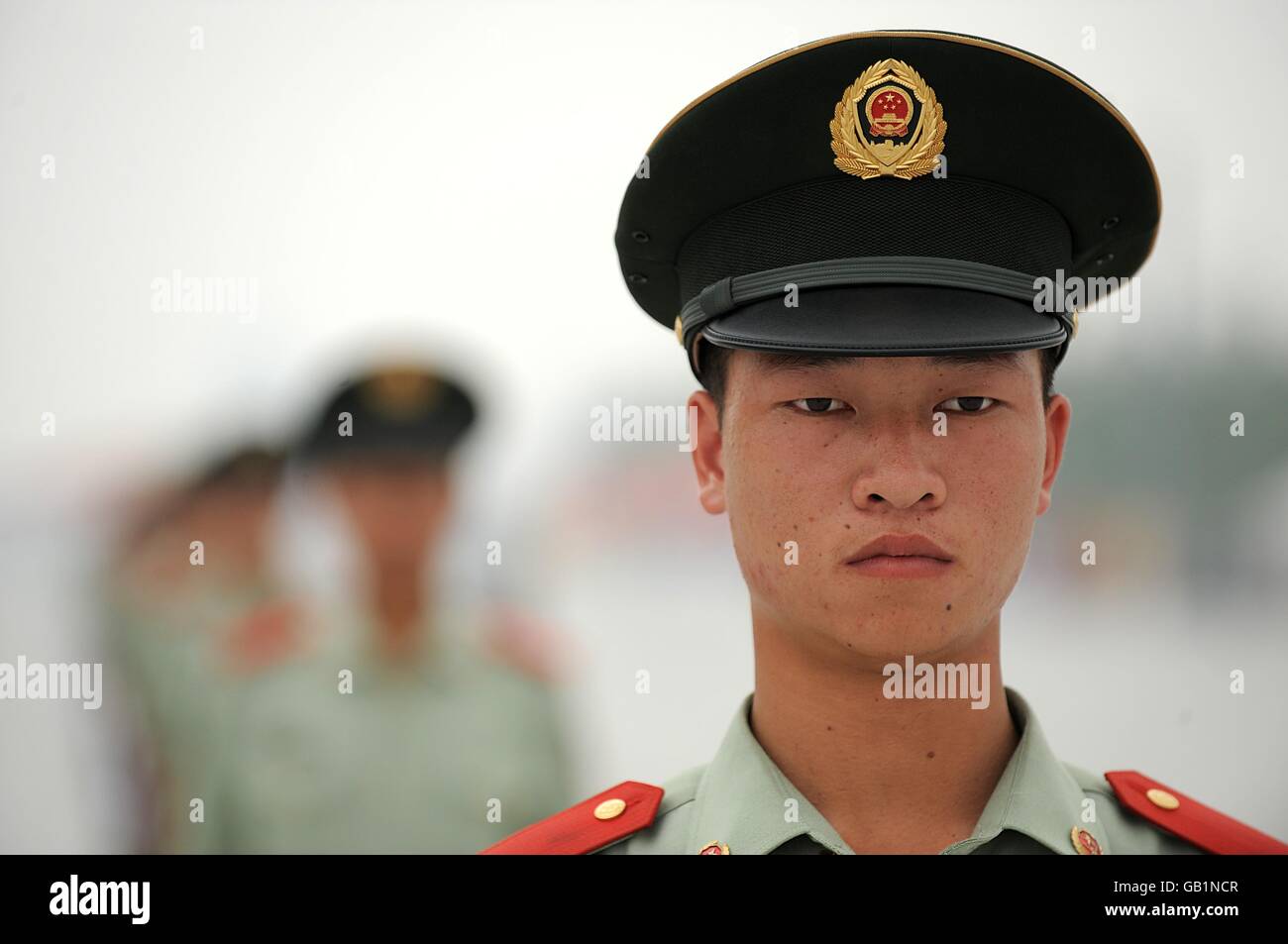 Security guards march outside the olympic national stadium hi-res stock ...
