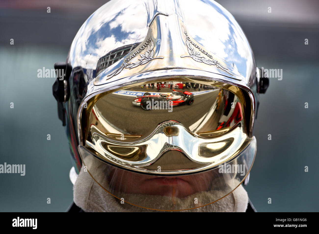 Vodafone mclaren mercedes lewis hamiltons reflection in a firemans ...