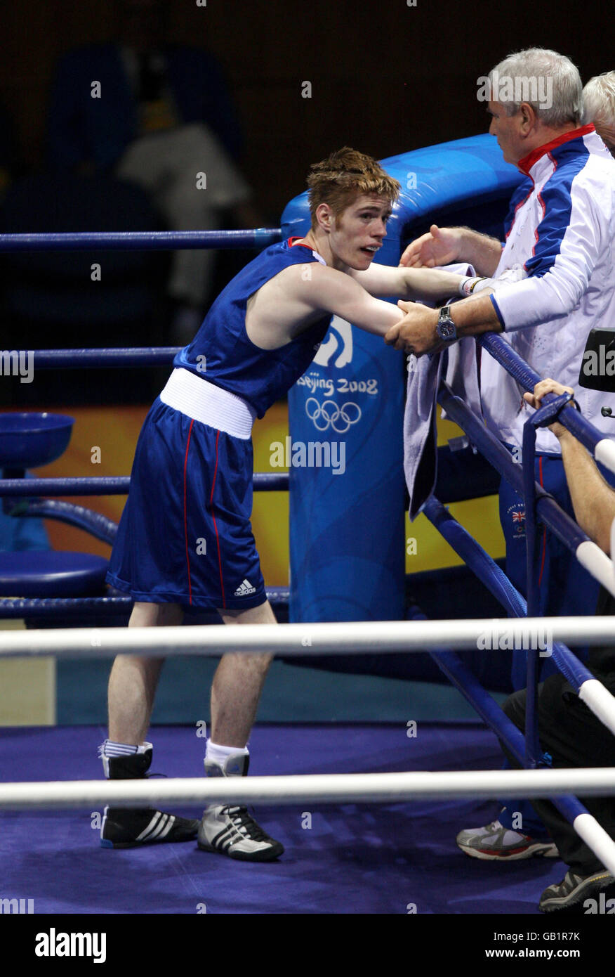 Great Britain's bantamweight boxer Joe Murray stands dejected as he ...