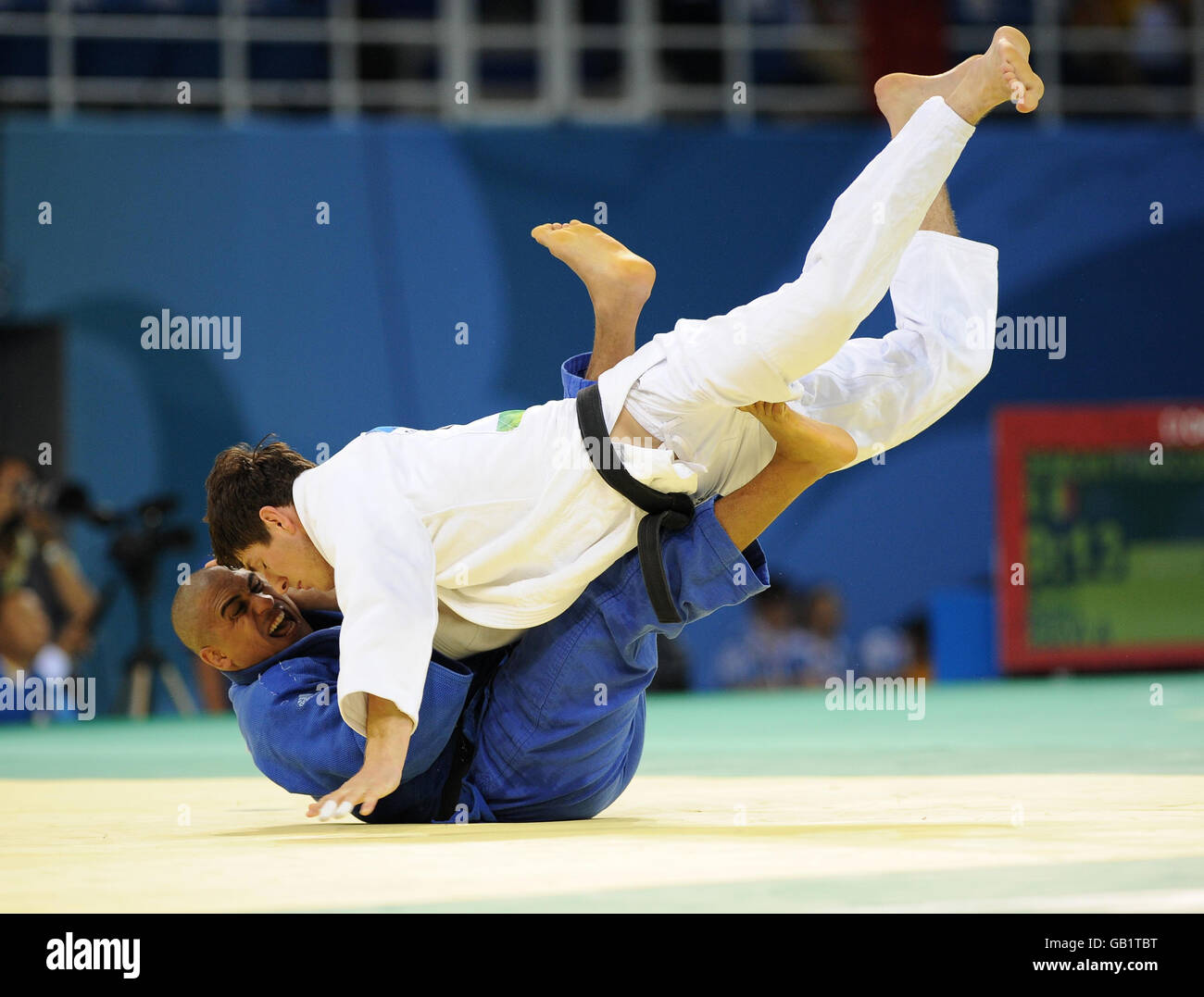 Great Britain's Peter Cousins (blue) in action against Georgia's Levan ...