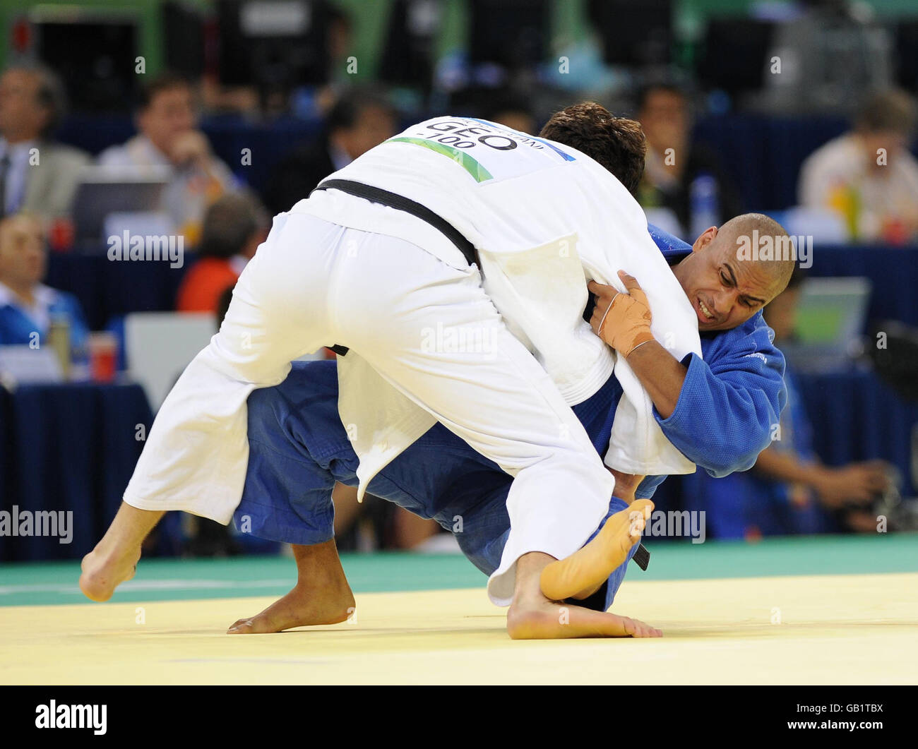 Great Britain's Peter Cousins (blue) in action against Georgia's Levan ...