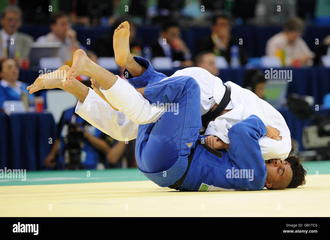 Great Britain's Peter Cousins (blue) in action against Georgia's Levan ...