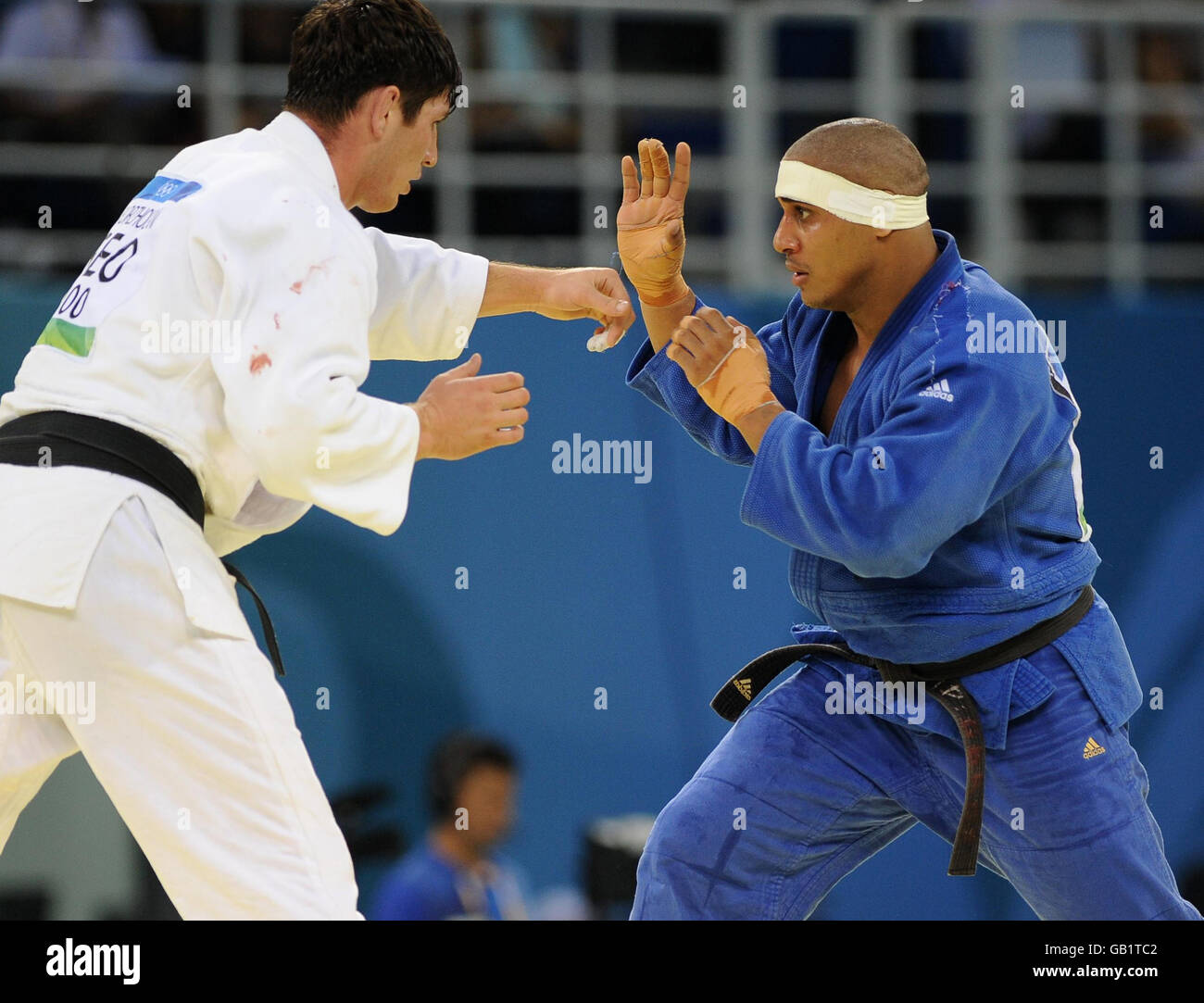 Great Britain's Peter Cousins (blue) in action against Georgia's Levan ...