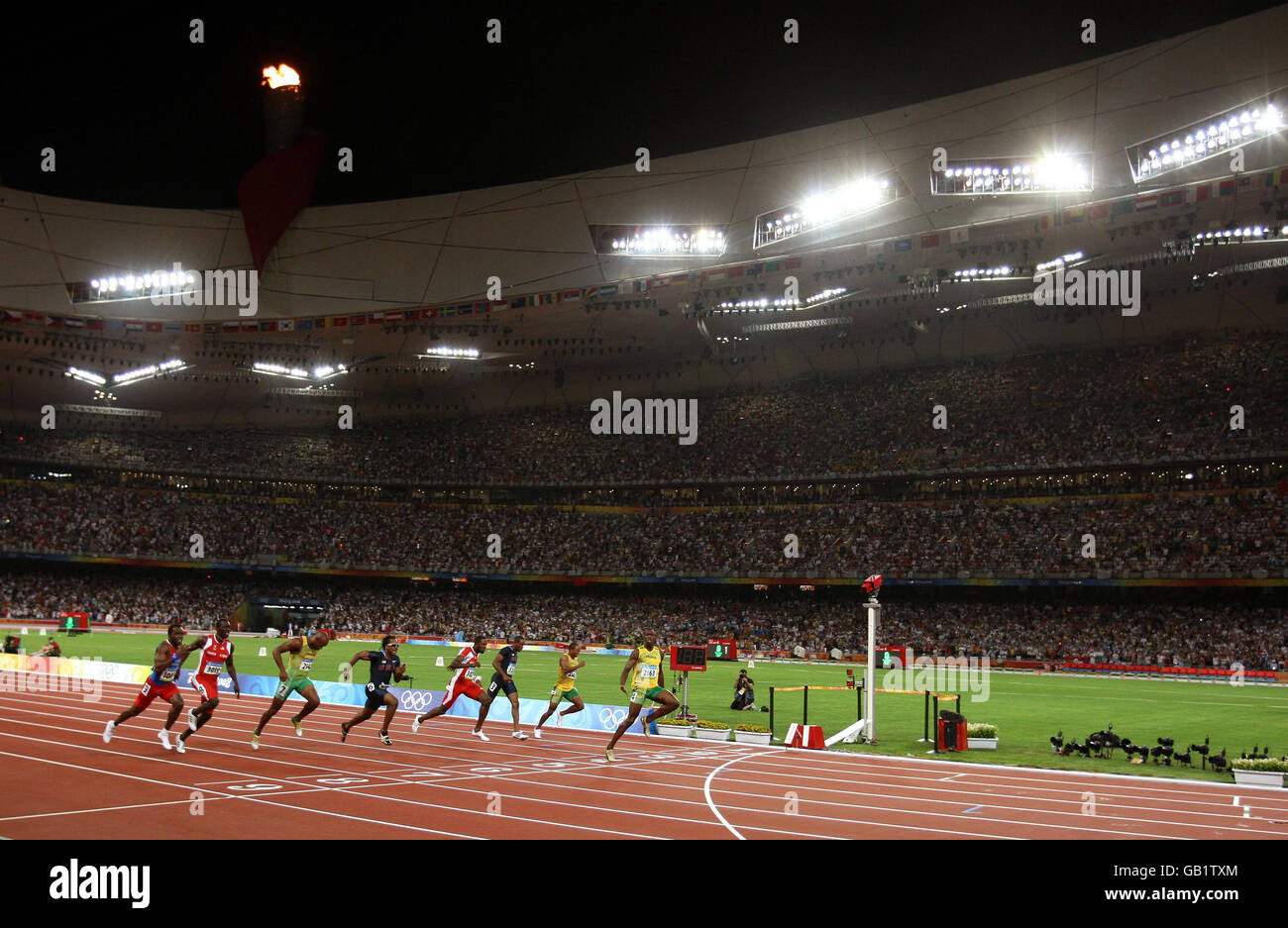 Jamaica's Usain Bolt wins the gold medal and breaks the world 100m ...
