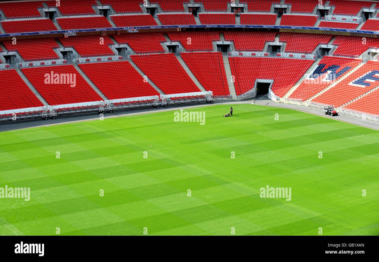 A groundsman cuts the grass at Wembley Stadium, Wembley, London Stock ...