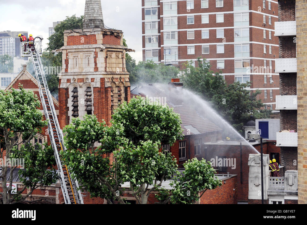 Fire at church in London. Firemen tackle the remains of a fire at the ...