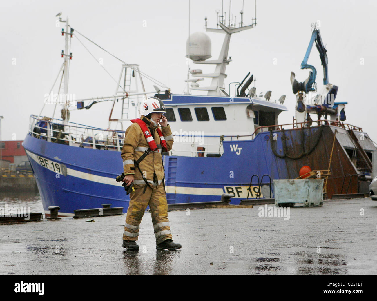 Fire on fishing boat Stock Photo - Alamy