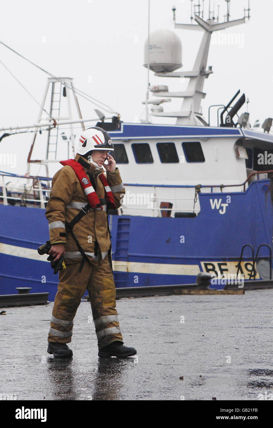 Fire on fishing boat Stock Photo - Alamy