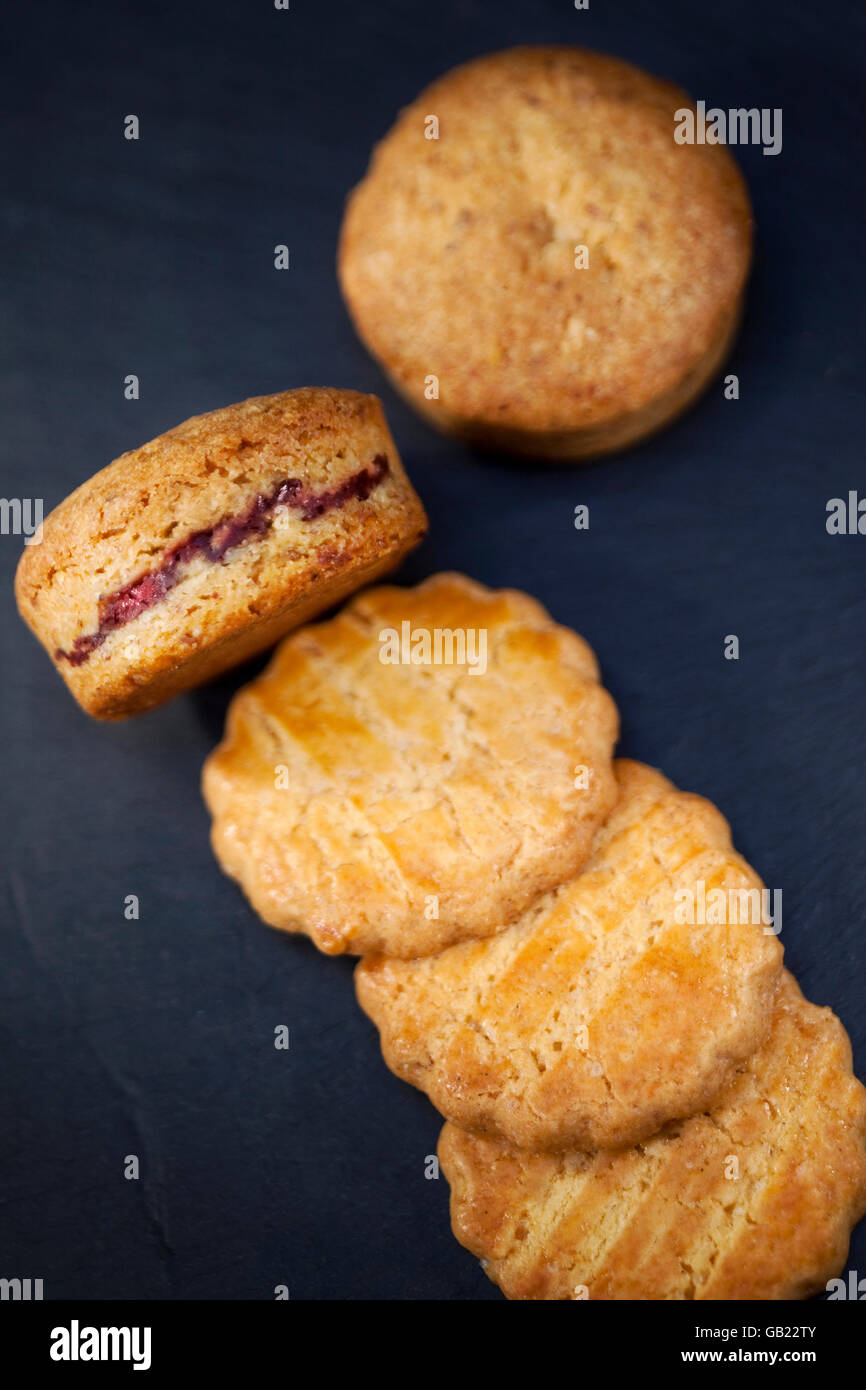 Crispy shortbread cookies filled with raspberry cream Stock Photo - Alamy