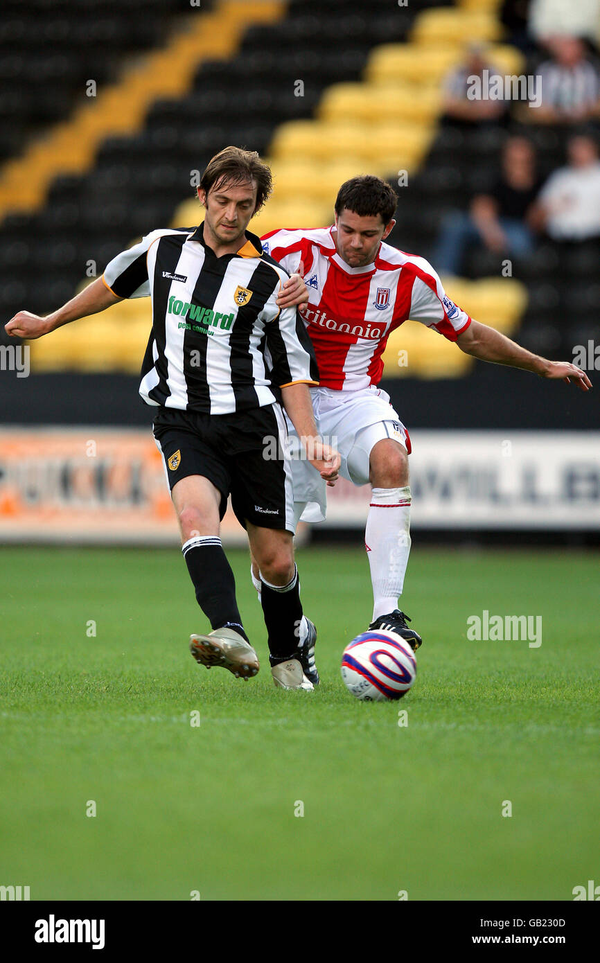 Notts County's Gavin Strachan (l) and Stoke City's Anthony Pulis battle ...