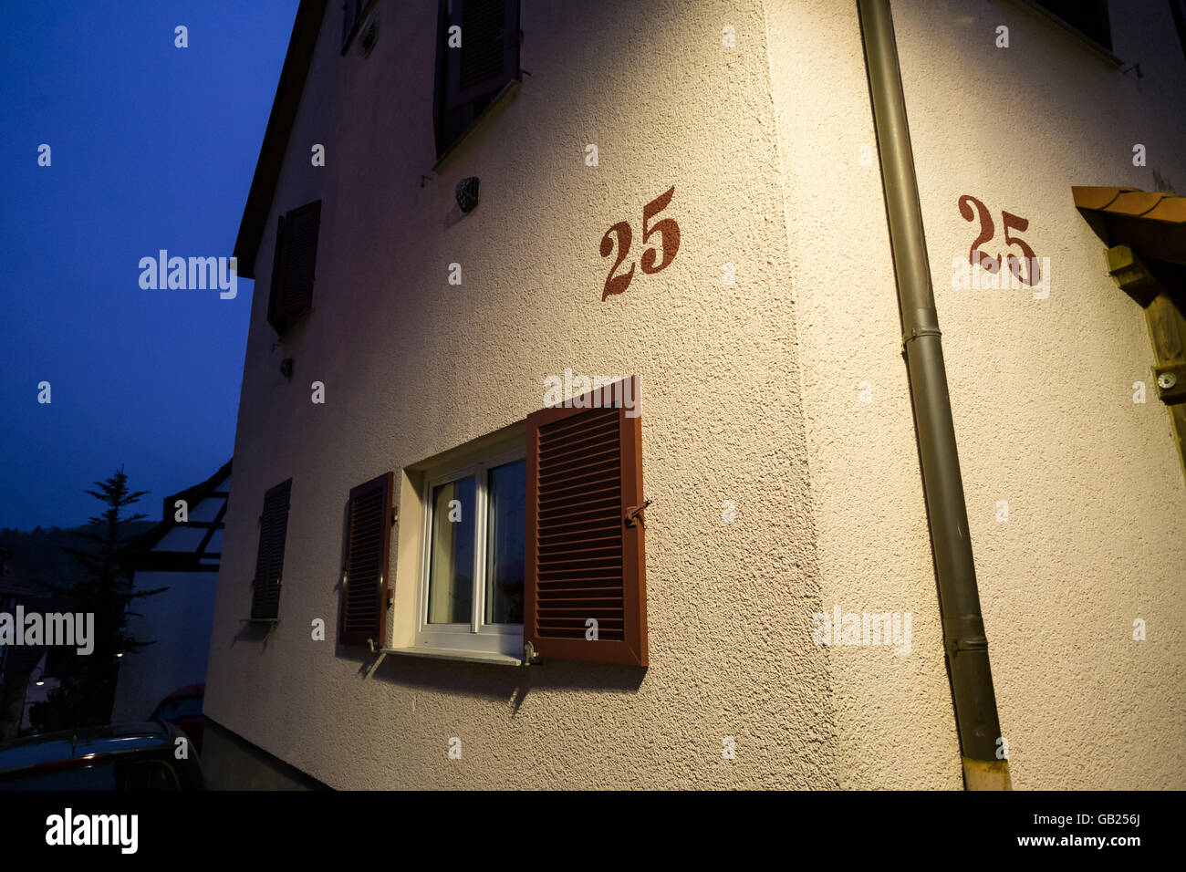 Resident house number 25 with windows in the night Stock Photo - Alamy