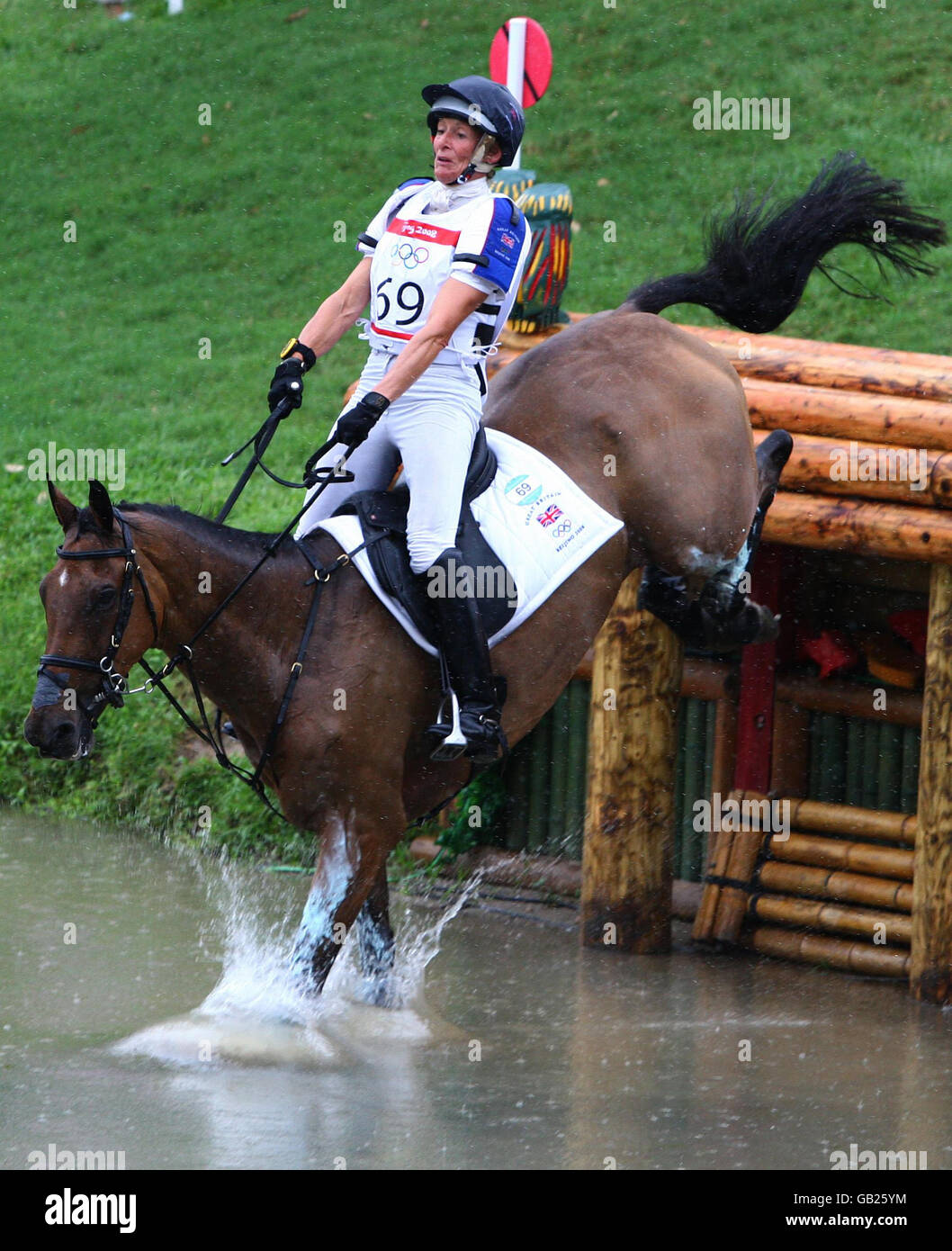 Britains Mary King on Call Again Cavalier at the water jump at fence 5/ ...
