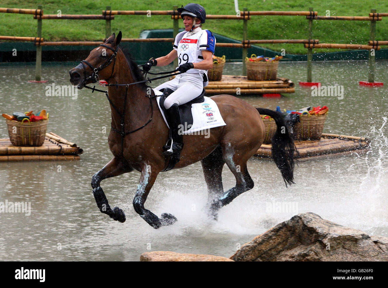 Great Britains Mary King on Call Again Cavalier at the water jump at ...